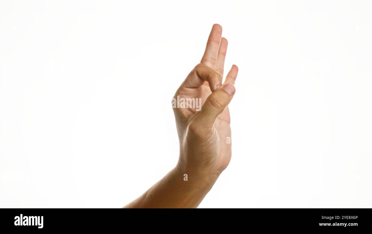 Male hand making an okay gesture with fingers over isolated white ...
