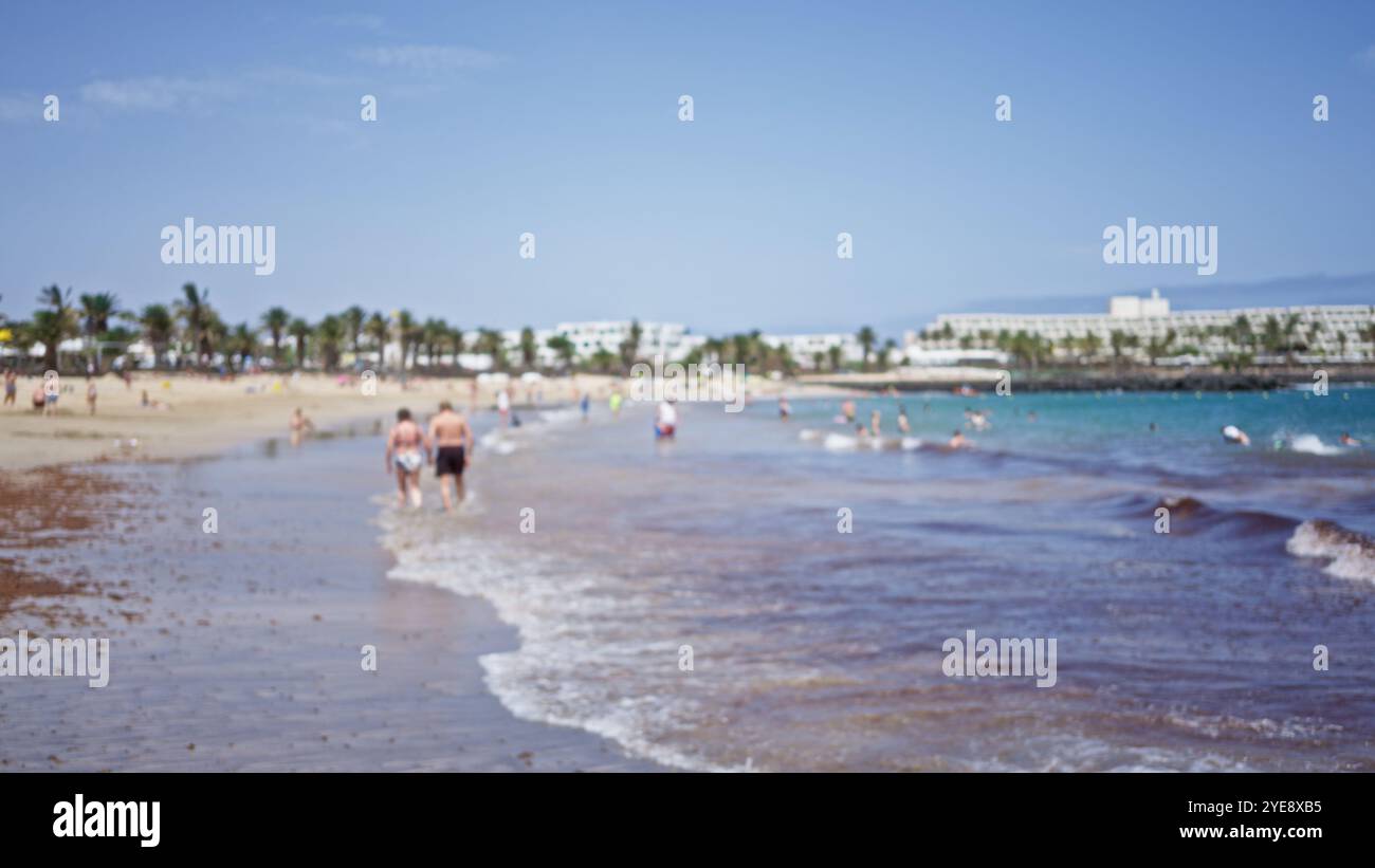 Blurred people walking along sandy hi-res stock photography and images ...