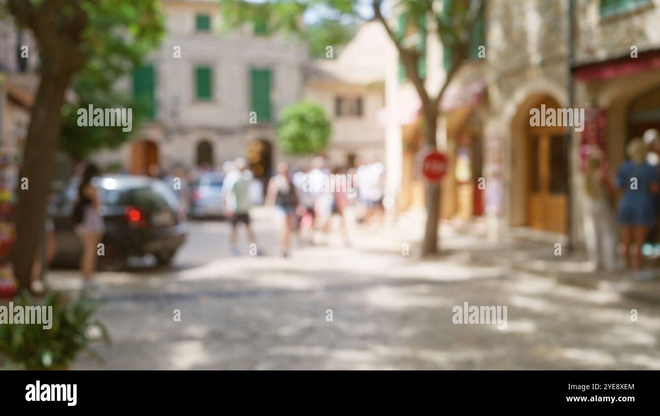 Blurred view of people walking through an outdoor street scene in ...