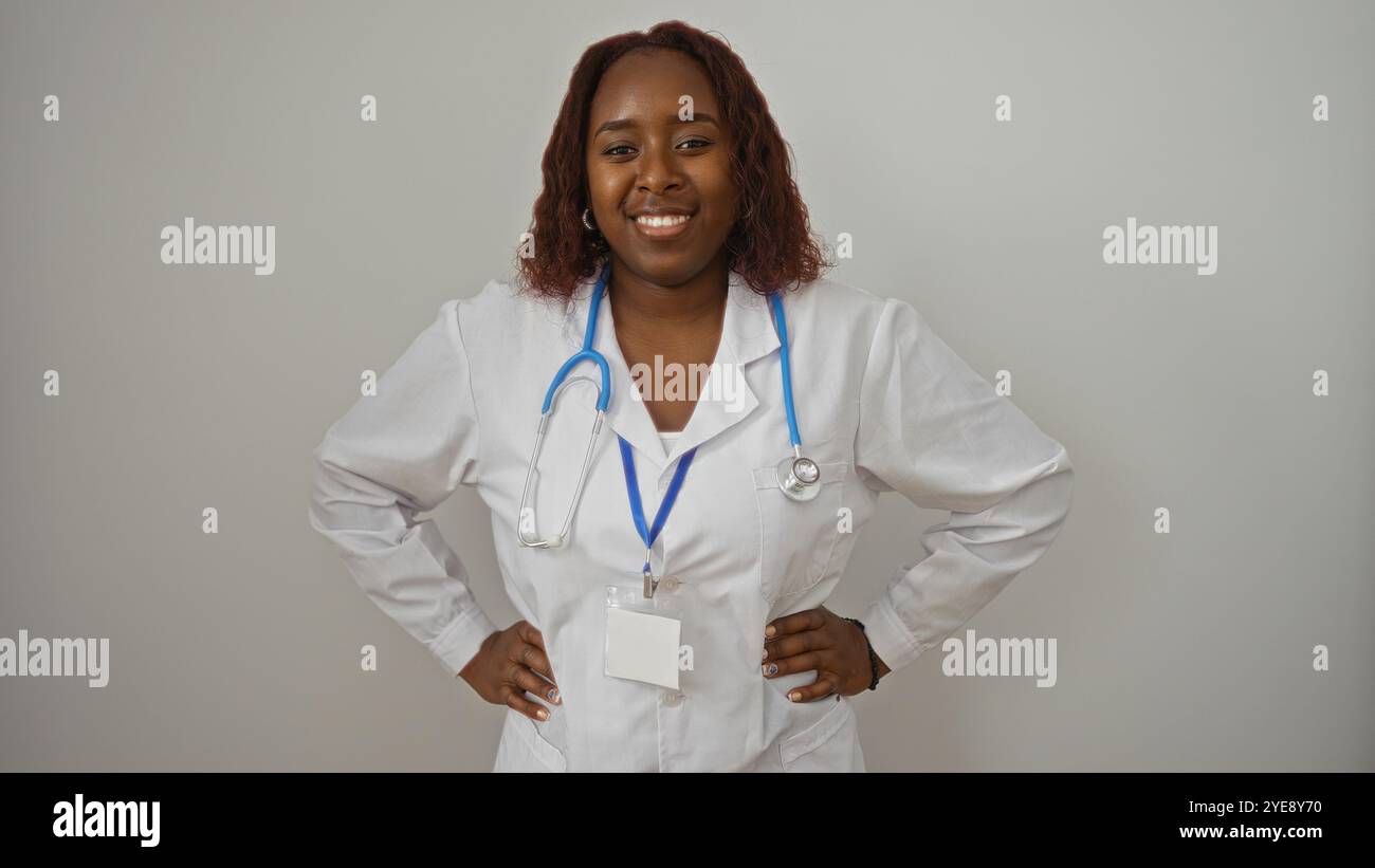 Female african american doctor stands confidently with stethoscope over ...