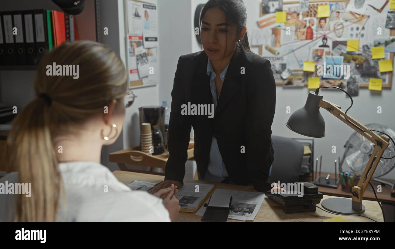 Two women in a detective office, one standing with documents ...