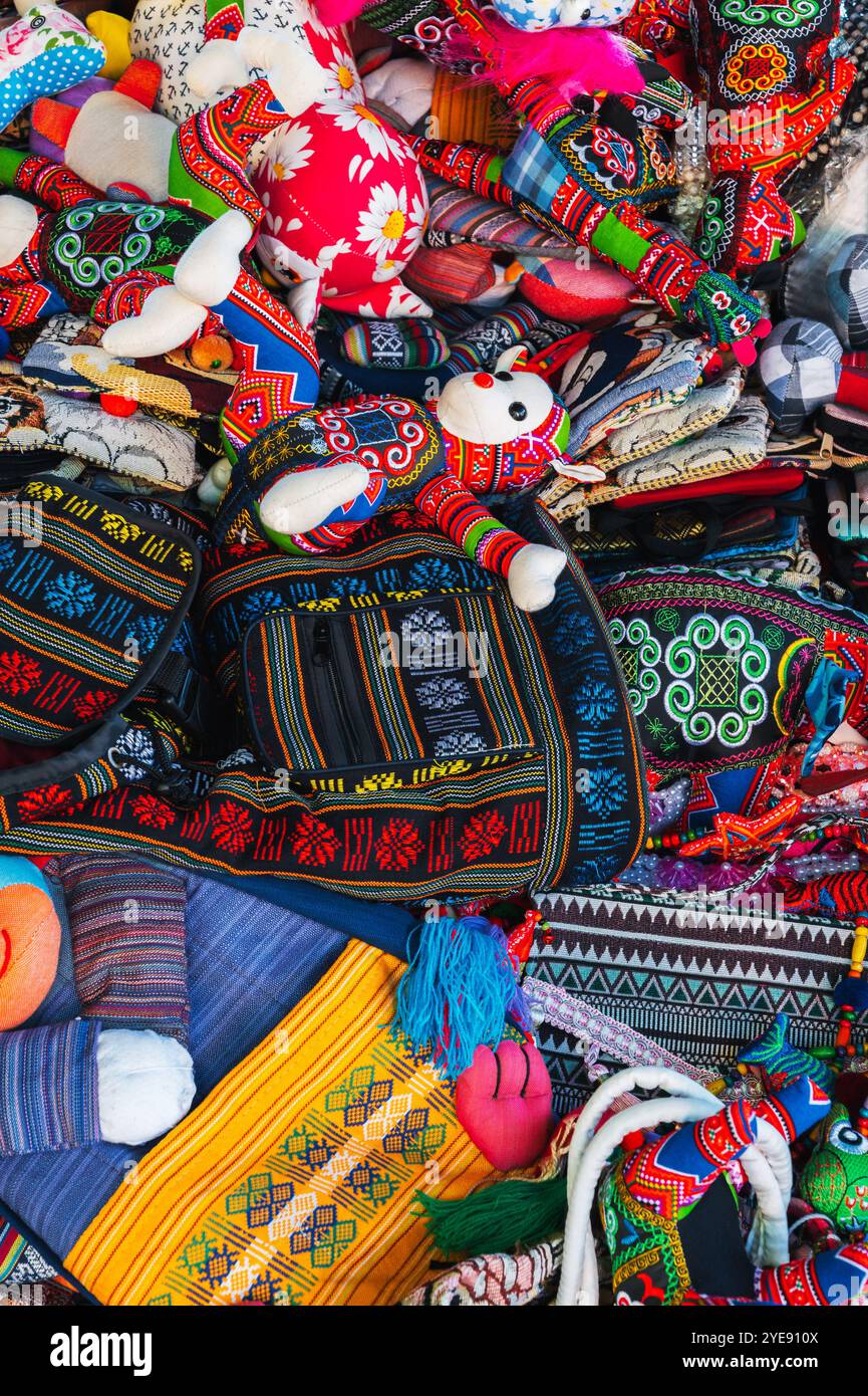 Colorful bags and various textiles on the counter at a street bazaar in ...