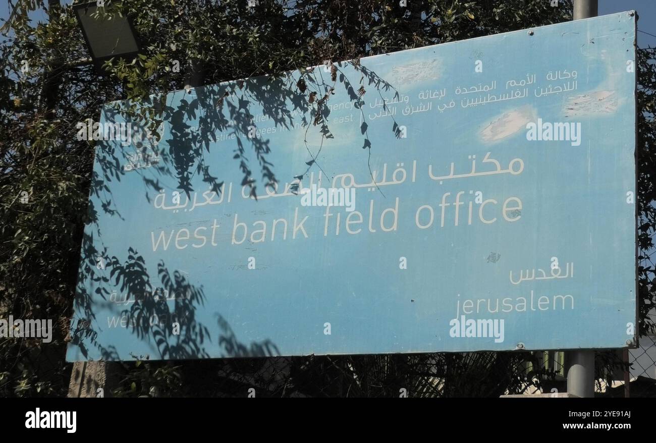 ERUSALEM - OCTOBER 30: A sign of the West Bank Field office of UNRWA ...