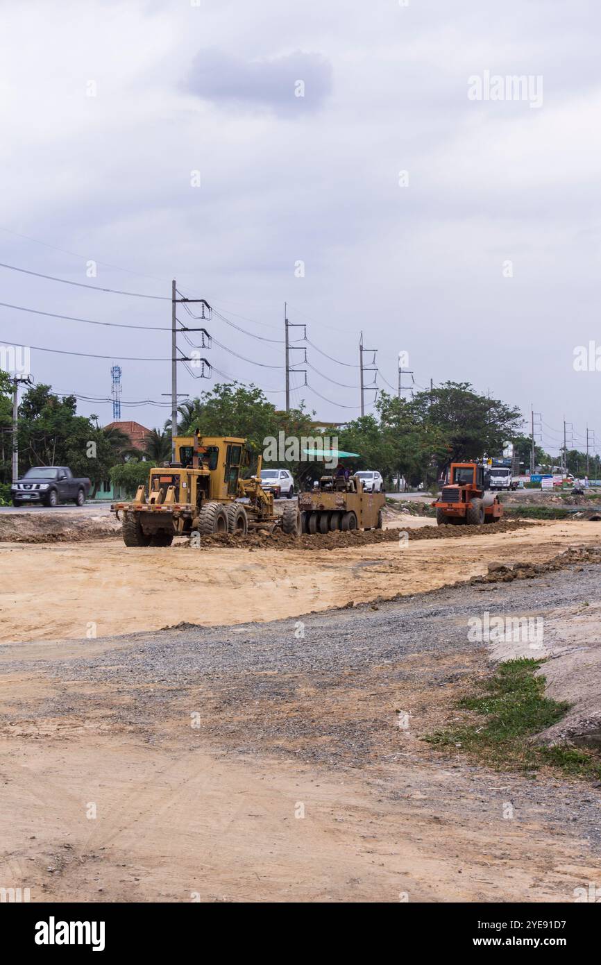 Tractor with Steamroller road roller leveling Stock Photo - Alamy