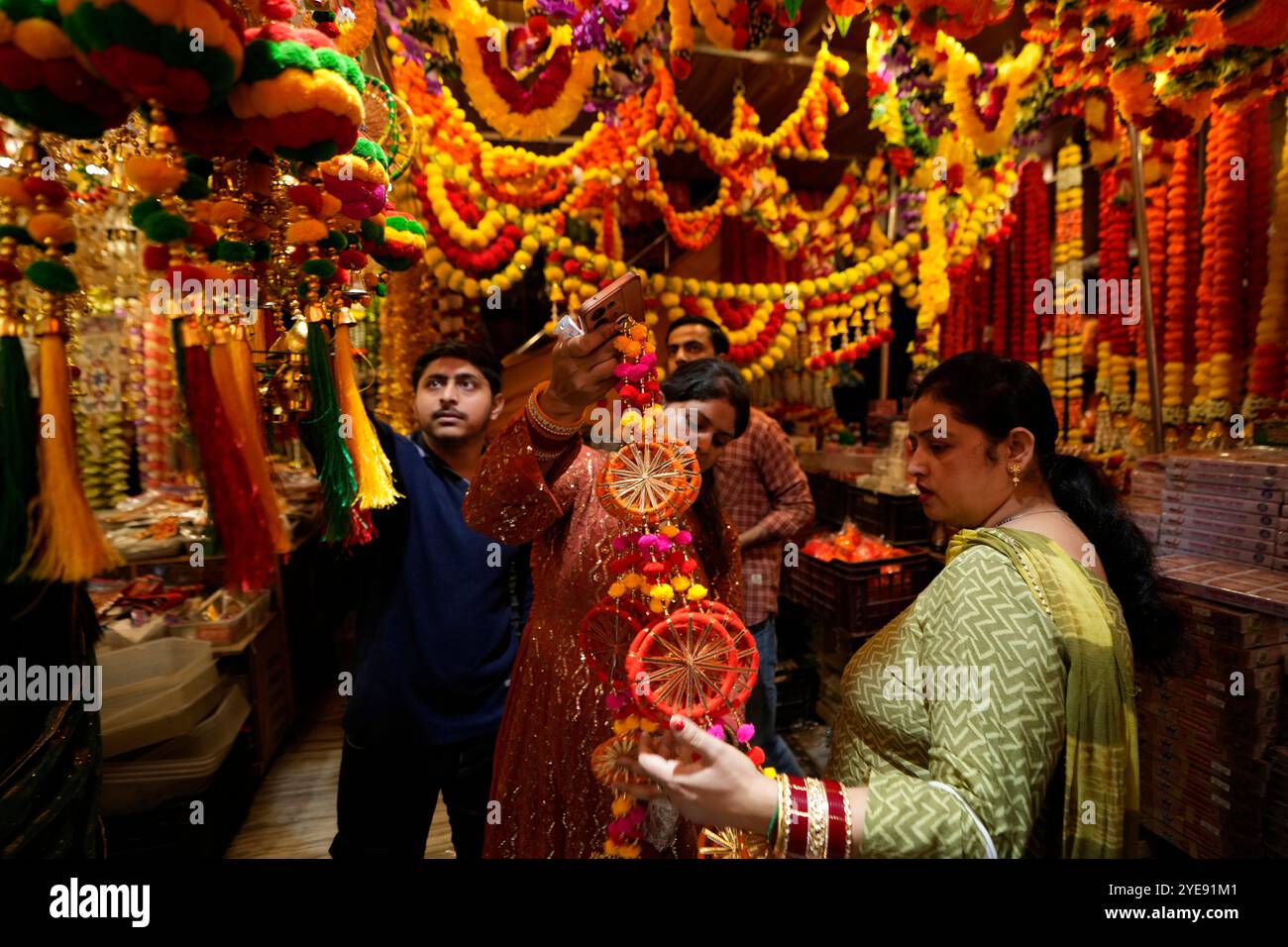 Women shop on the eve of Diwali, the Hindu festival of lights, in Jammu ...