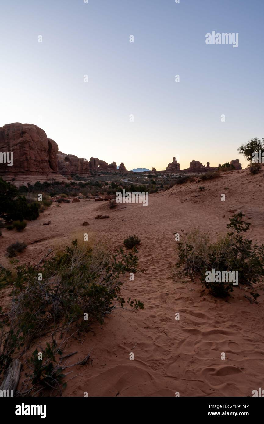 A stunning view of red rocks during golden hour in Arches National Park ...