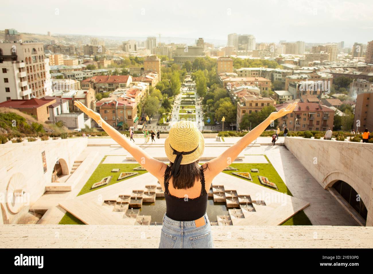 Happy tourist girl enjoy cascade complex viewpoint with raised her ...