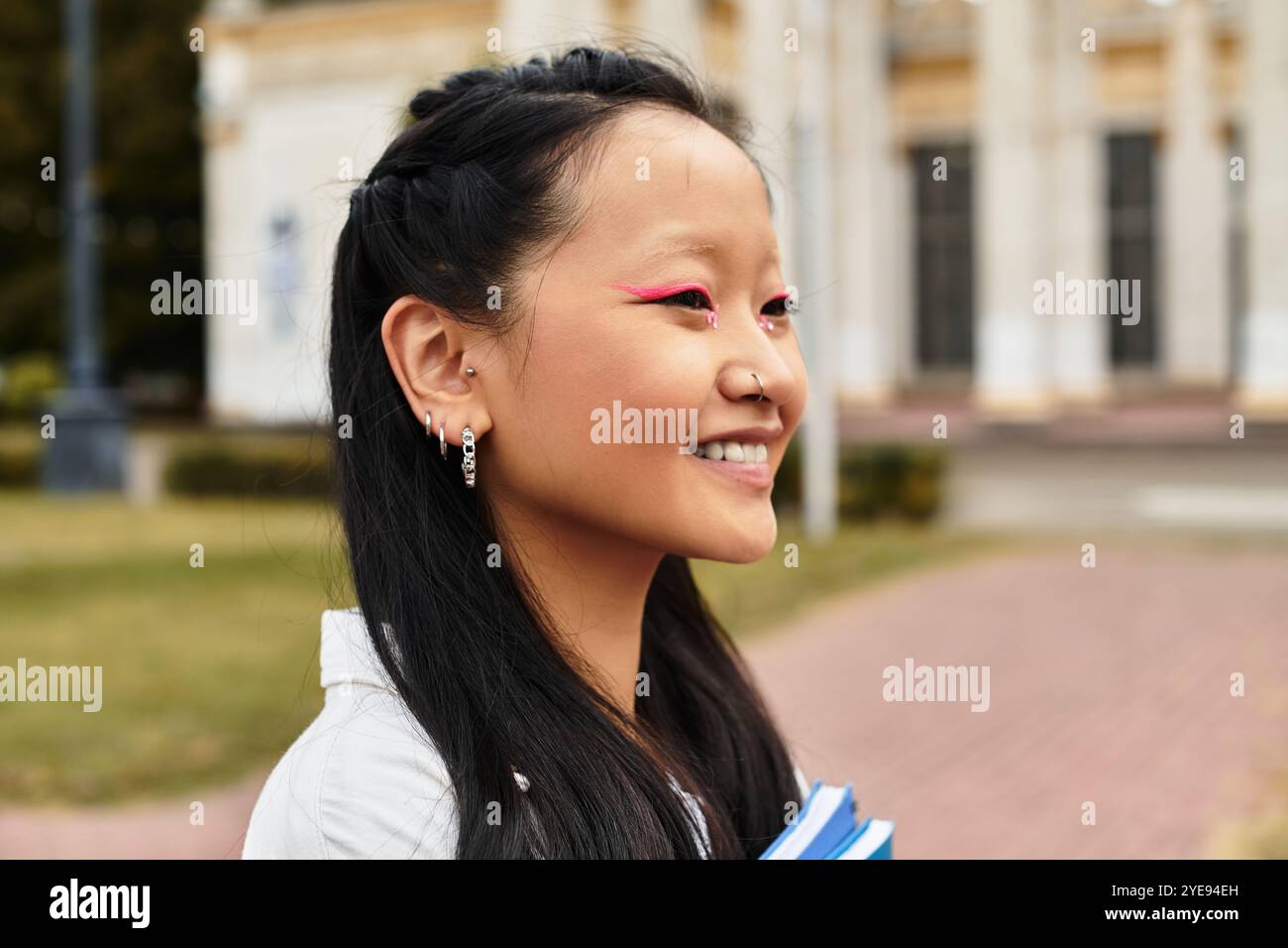 A cheerful student confidently walks near her university, showcasing ...