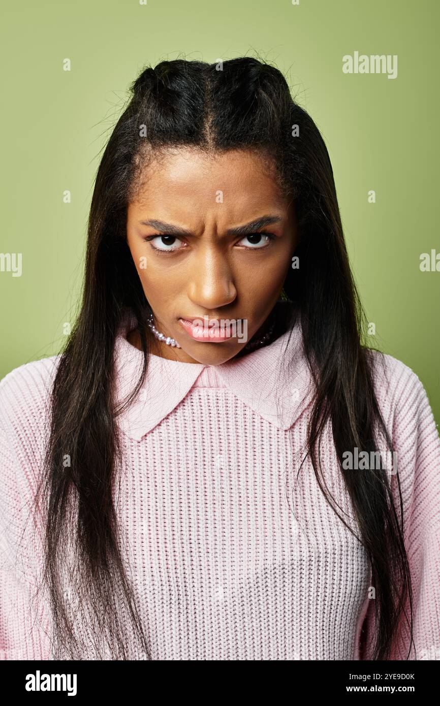 The young woman showcases her stylish warm autumn outfit while ...