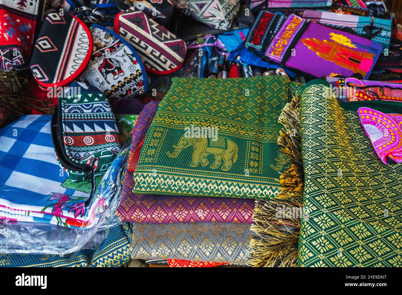 Colorful bags and various textiles on the counter at a street bazaar in ...