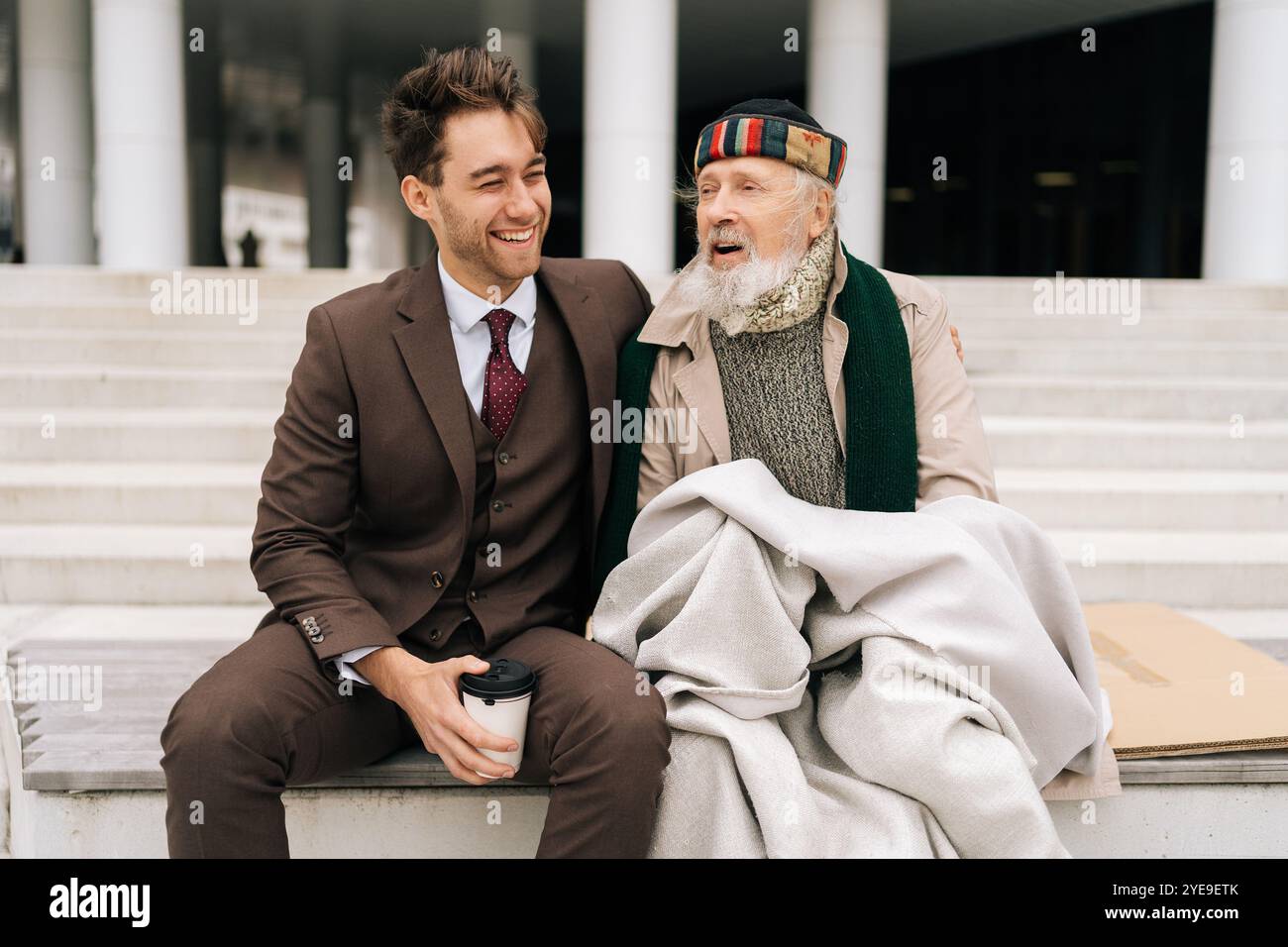 Smiling compassionate professional in business attire comforting ...