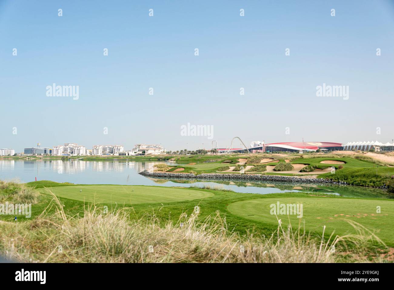 Golf and country club on a sunny day with residential buildings in the ...