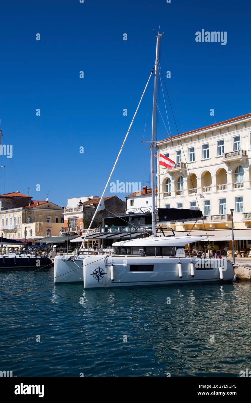 Boats in the harbour and waterfront restaurants in the historic city of ...
