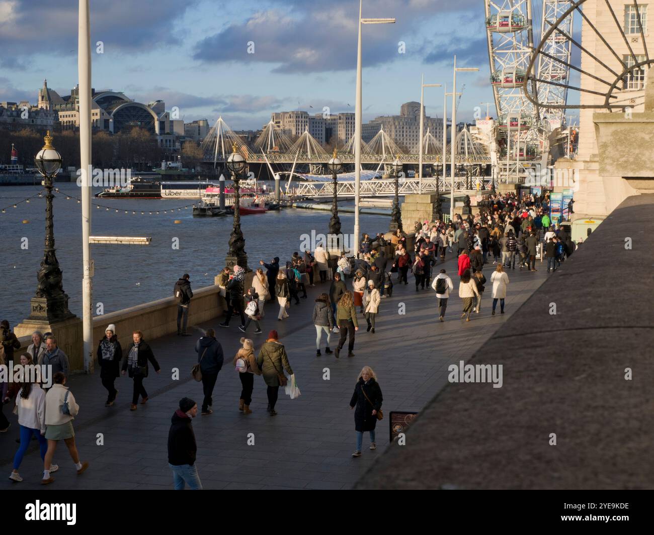 View of Thames Path and river from Westminster Bridge with people ...