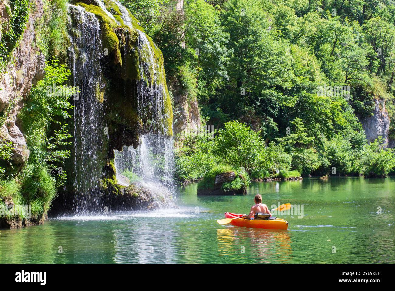Canoe and cascade near Castelbouc village in the valley of the Tarn ...