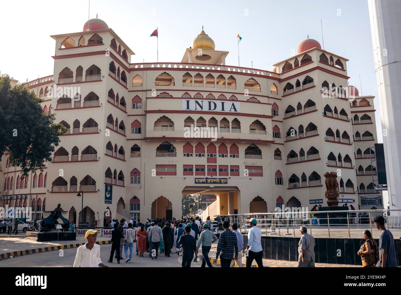 Pedestrians and building at the Attari-Wagah border between India and ...