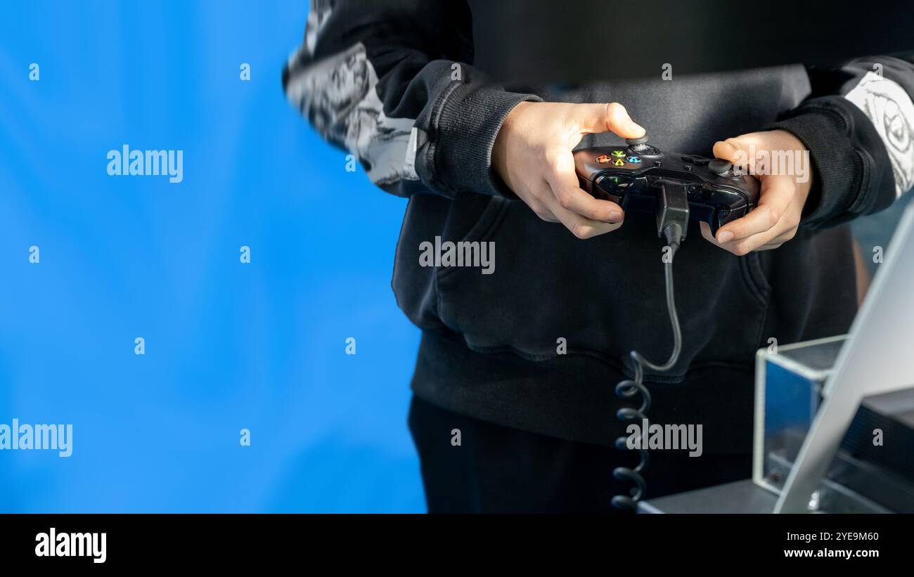 Gamer playing on playstation controller hi-res stock photography and ...