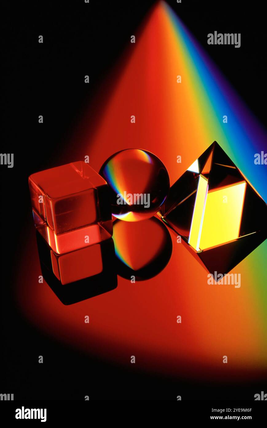 Cube, Sphere and Pyramid under a colourful refraction; Studio Stock ...