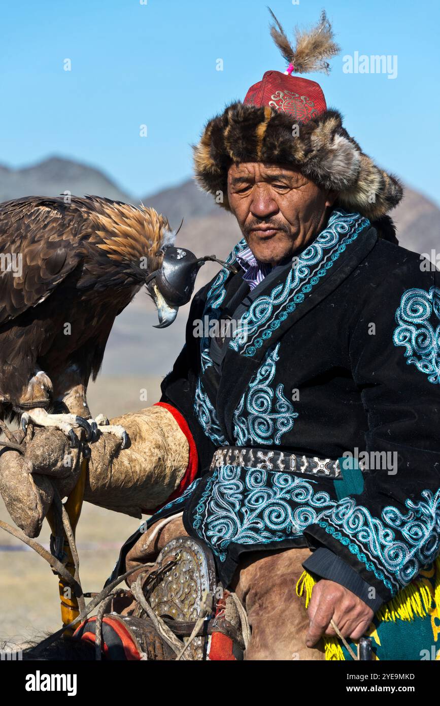 Mongolian Eagle Hunter on horseback with Golden Eagle (Aquila ...