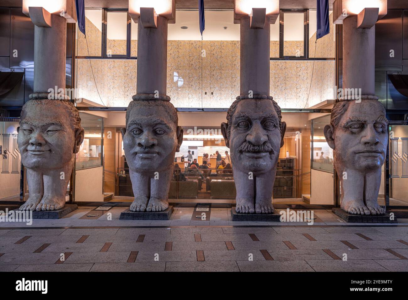 Four giant head sculptures building at night in osaka, japan Stock ...
