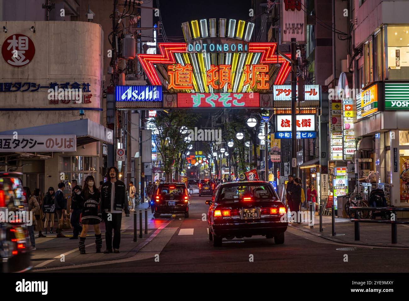 road in dotonbori, osaka, at night, with illuminated signs Stock Photo ...