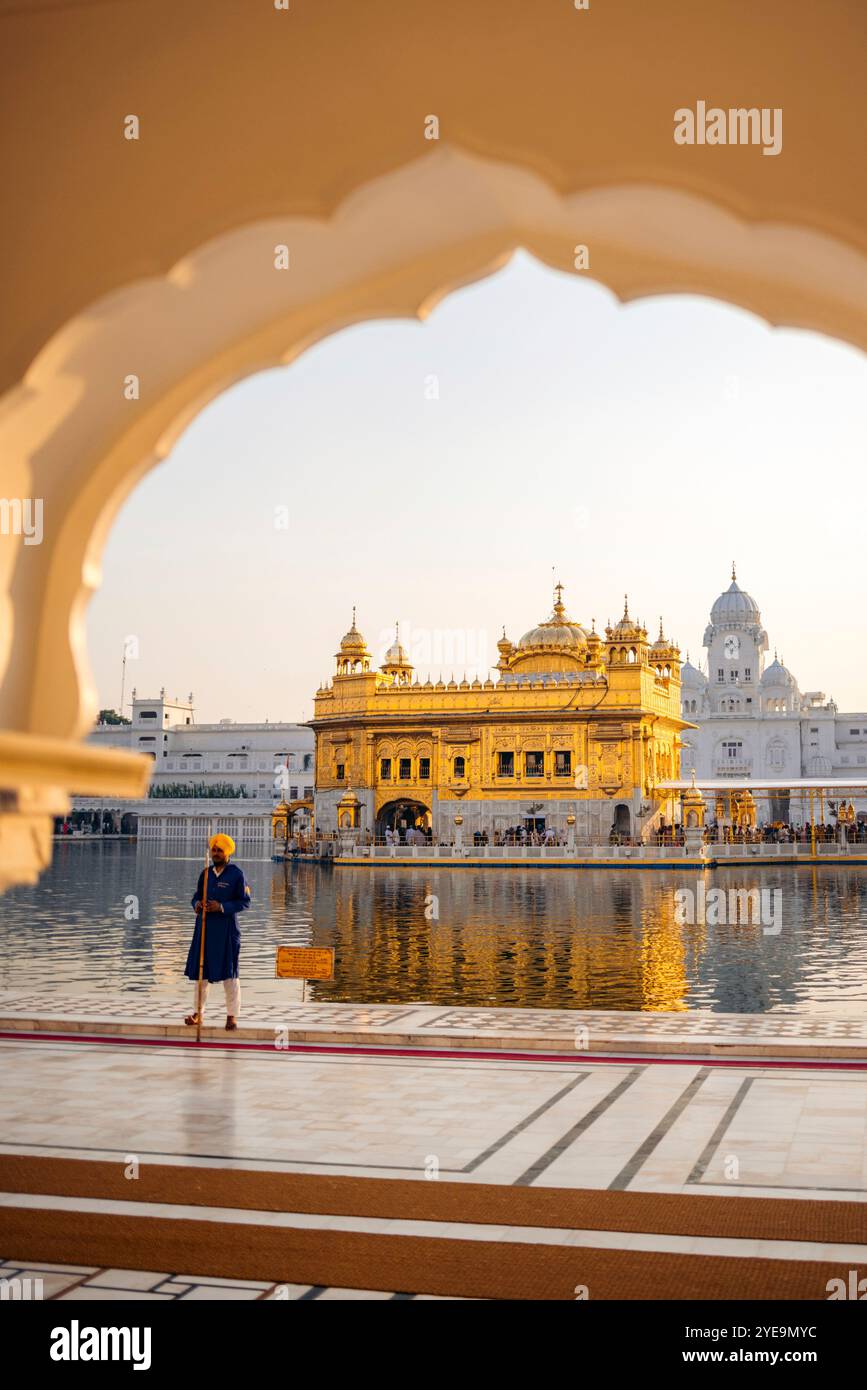 Golden Temple, a Sikh Gurdwara with pool of water and framed by a ...
