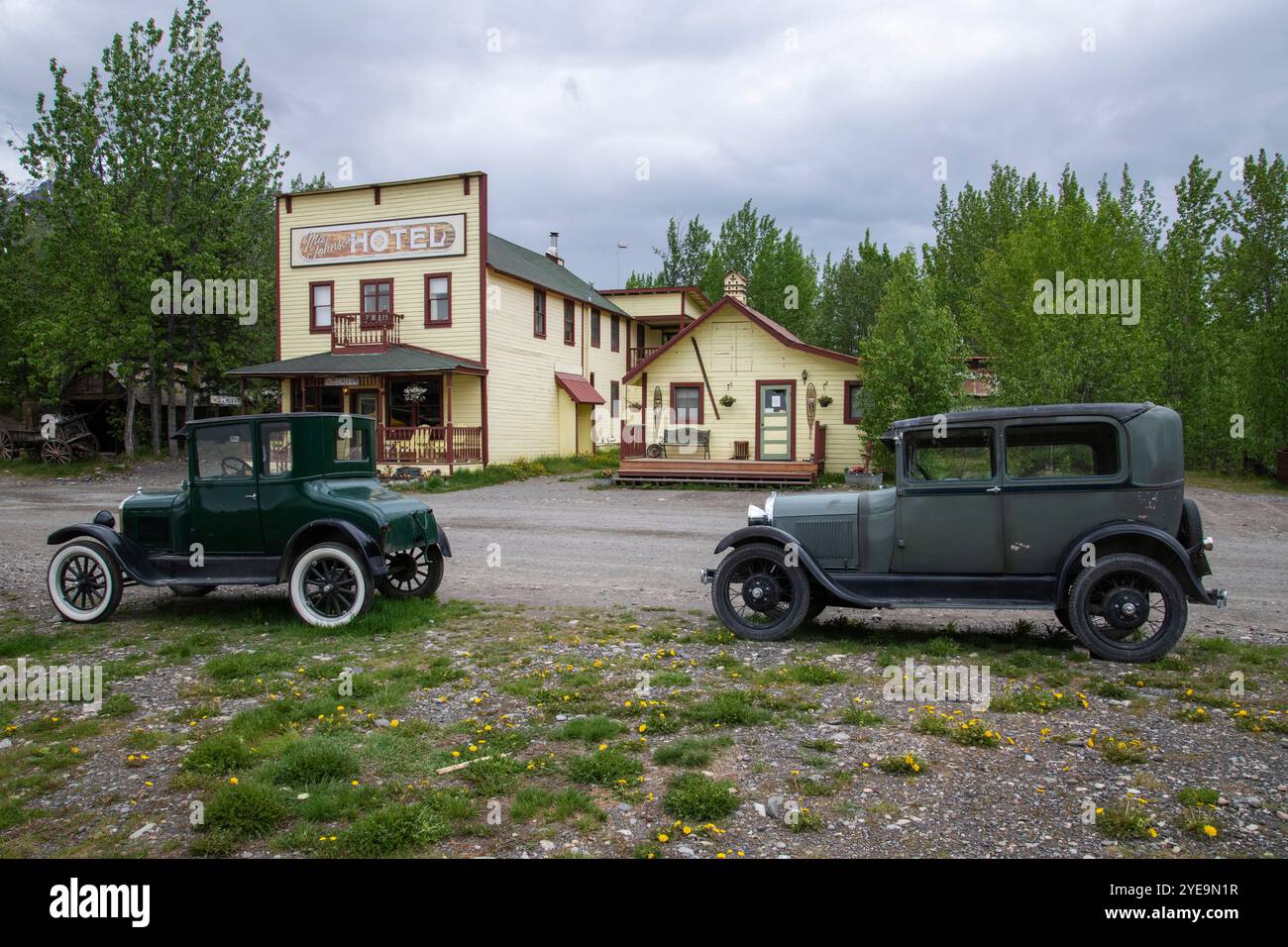 Historic vehicles and hotel building in the town of McCarthy in ...