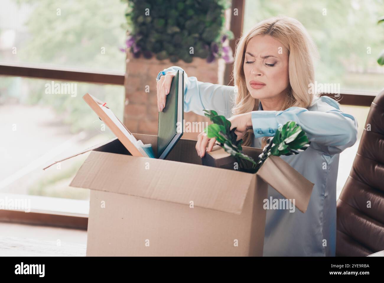Photo of corporate worker lady disappointed pack stuff box fired modern ...