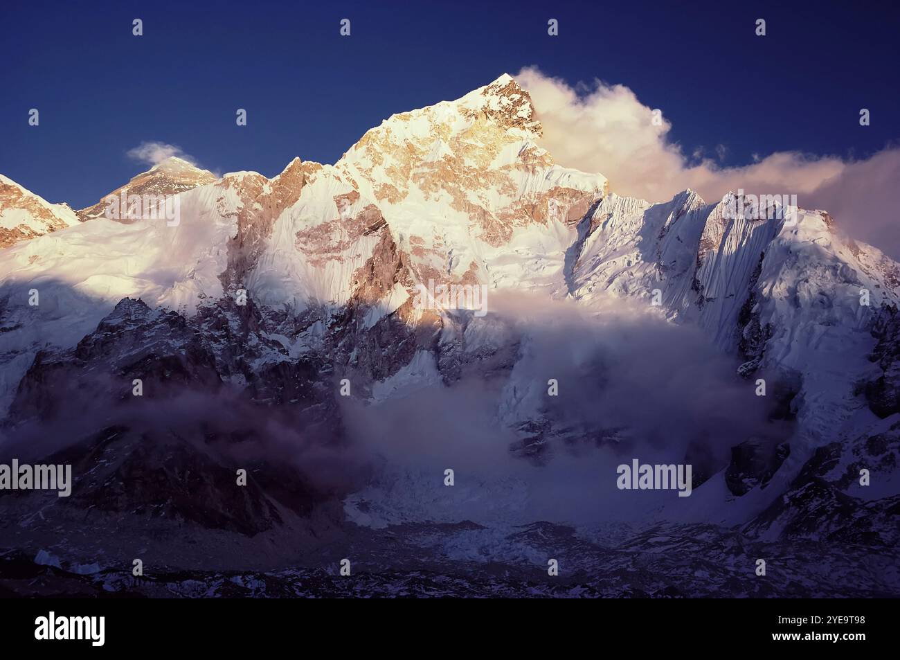 Mount Nuptse and Mount Everest illuminated by sunlight in the Himalayas ...