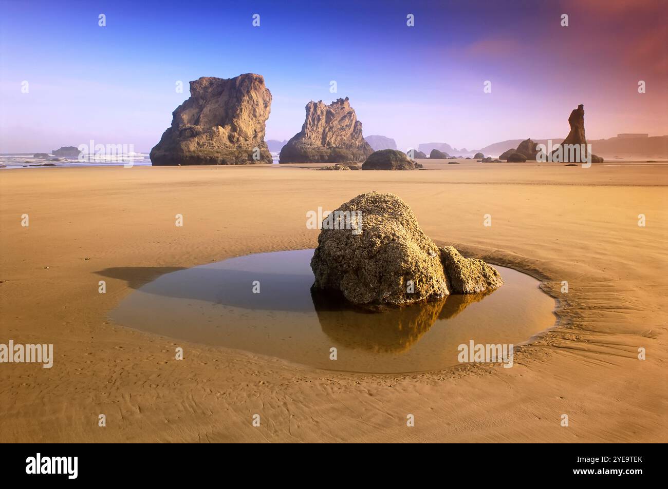 Rock in a tide pool on Bandon Beach at sunset, Oregon, USA; Oregon ...