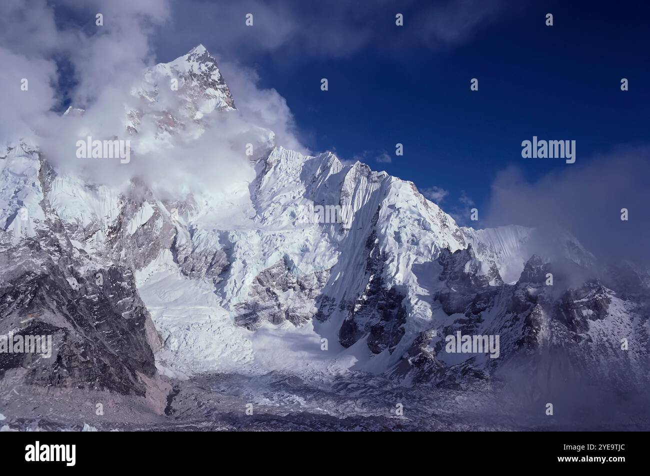 Rugged snow-covered peak of Nuptse in the Himalayas of Nepal, near ...