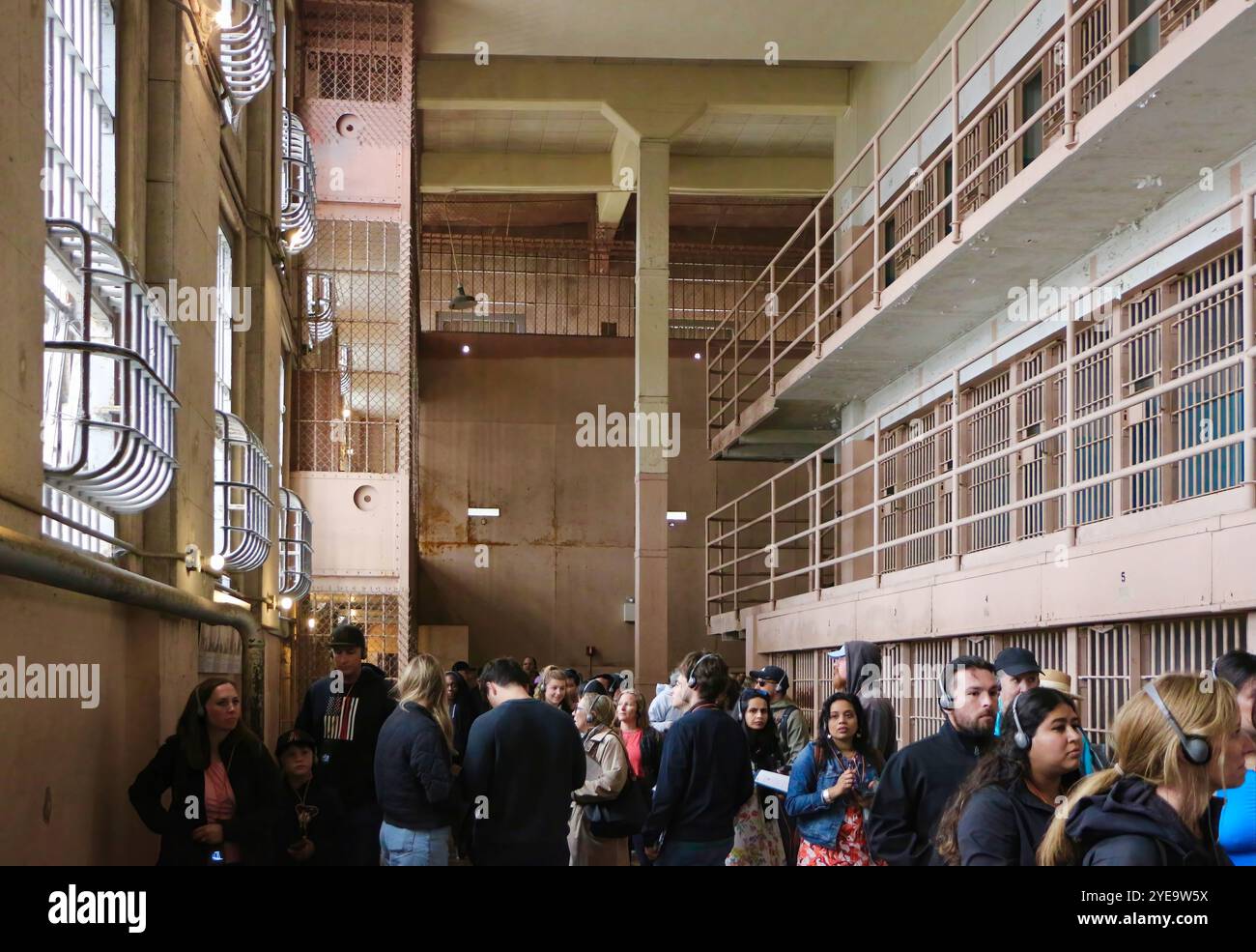 Tourists inside Alcatraz Federal penitentiary in the corridors with ...