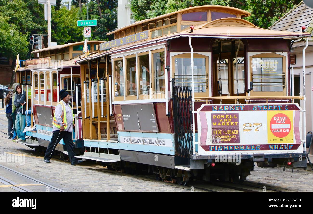 Tourists boarding an antique cable cars at the Powell/Hyde Cable Car ...