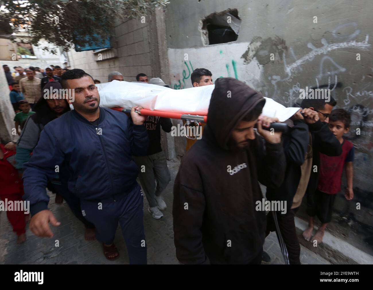 Members of the Palestinian Red Crescent ambulance perform the funeral ...