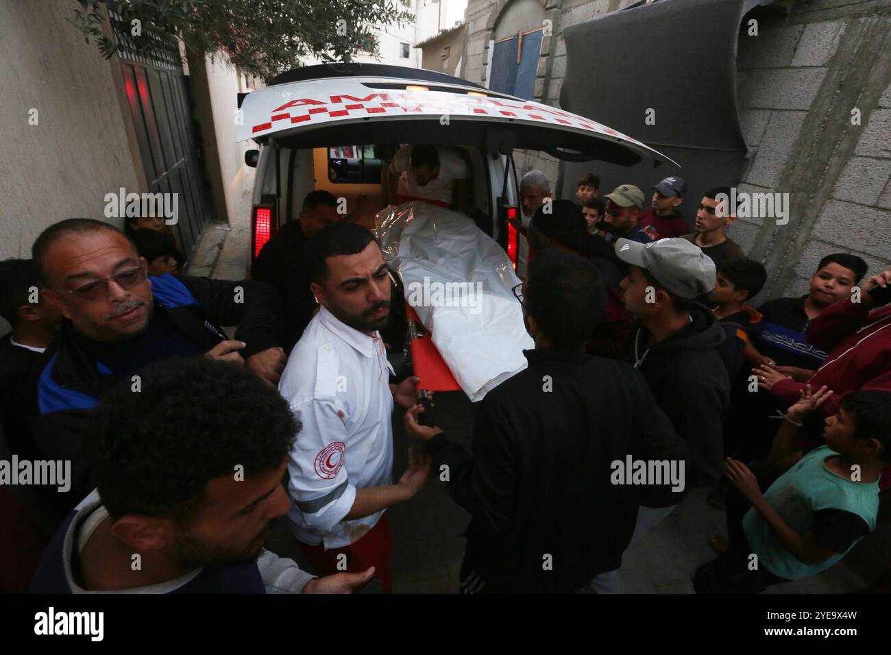 Members of the Palestinian Red Crescent ambulance perform the funeral ...