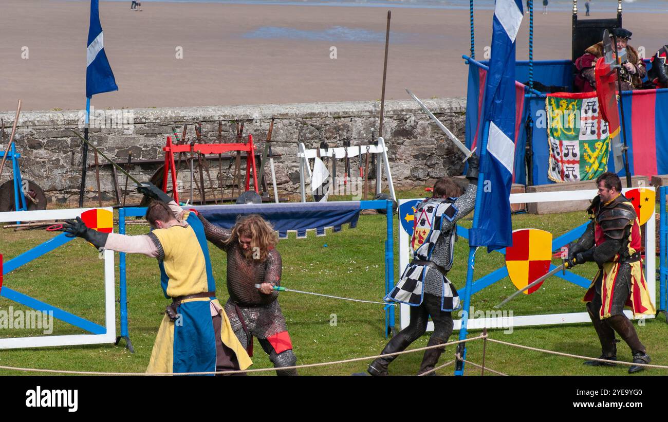4 Knights in Chainmail Swordfighting in Reenactment at Banburgh Castle ...