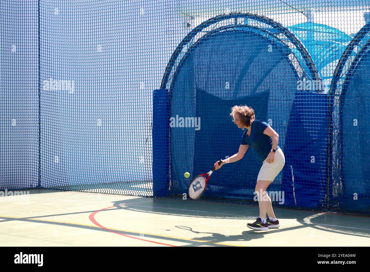 Netting covering the onboard games area on a cruise ship, as a female ...