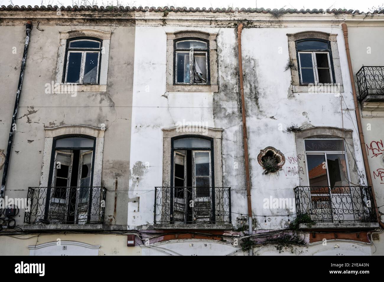 Close-up of an old stone building with windows and balconets in ...