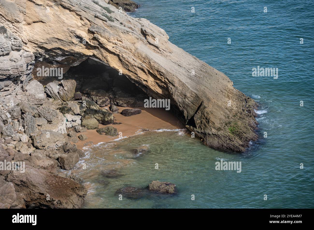 Beautiful rock cave and small beach along the coastline of Portugal ...