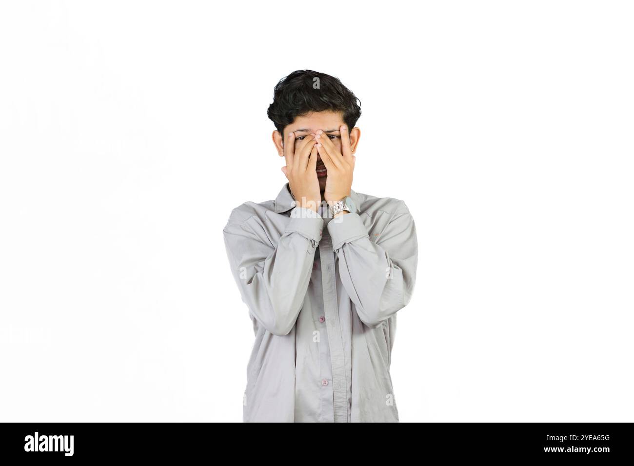 Young Teenager in shirt and vest gives expression of happiness and ...