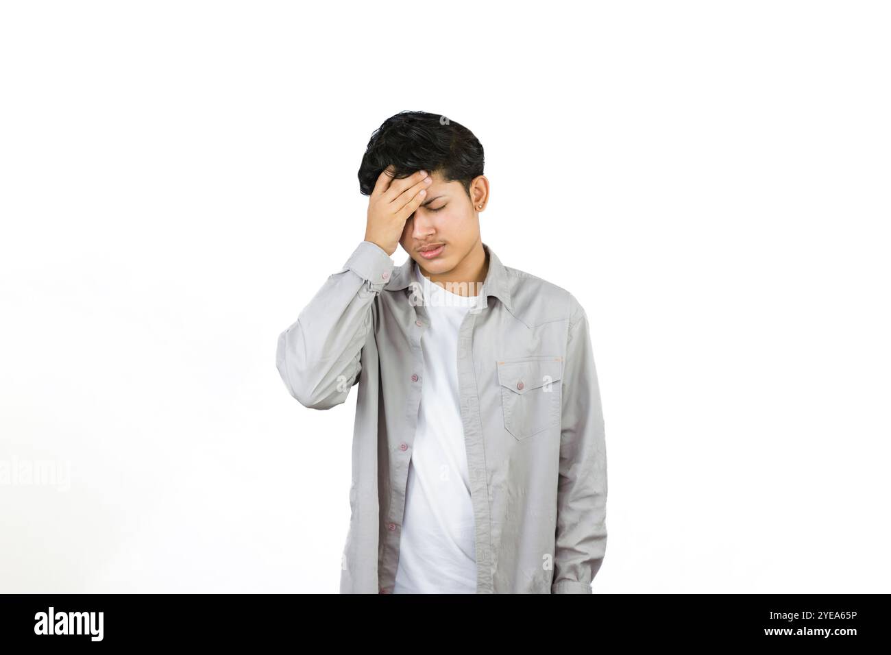 Young Teenager in shirt and vest gives expression of happiness and ...