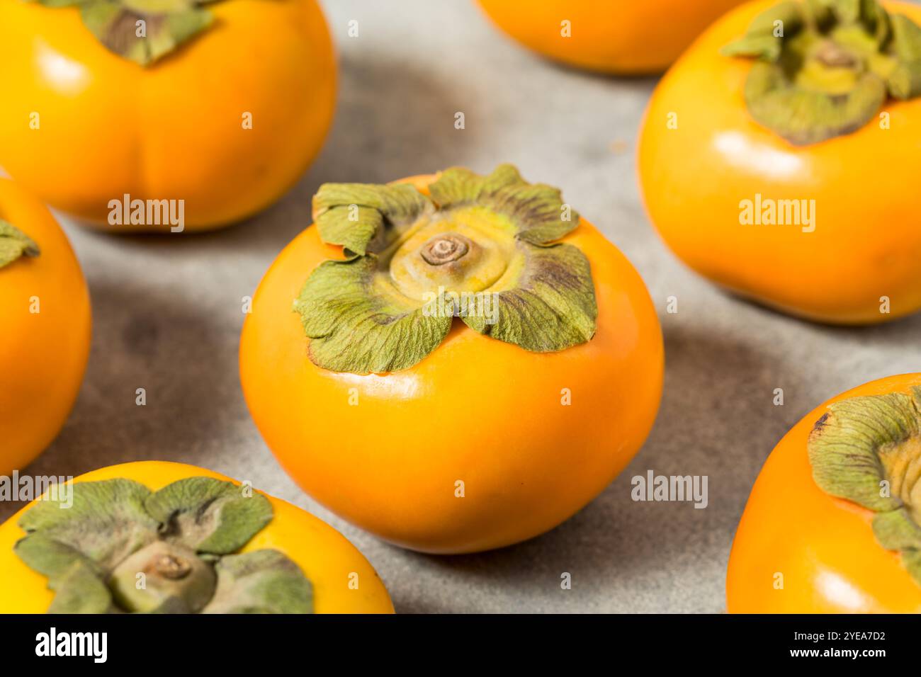 Raw Organic Orange Fuyu Persimmons in a Bunch To Eat Stock Photo - Alamy