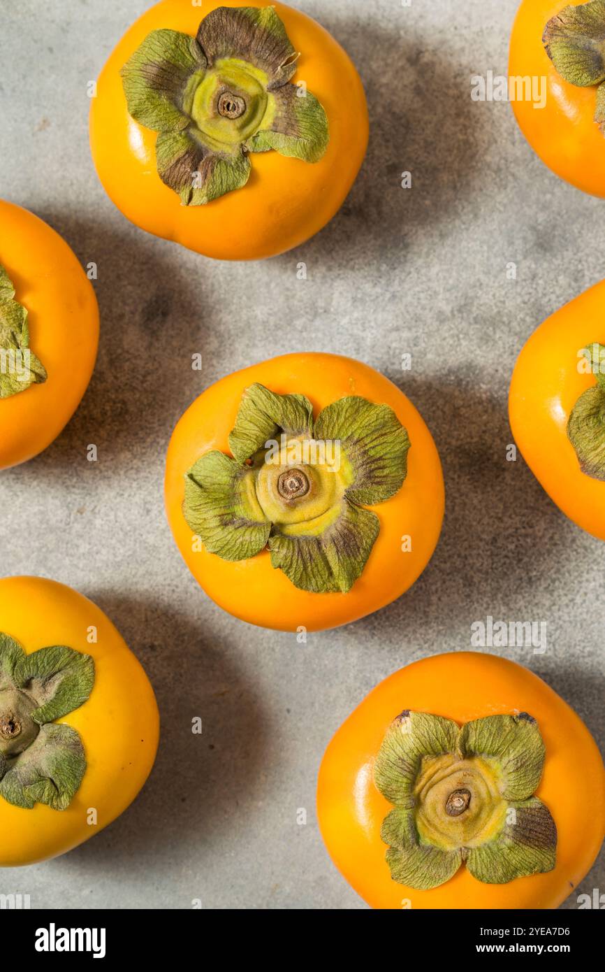 Raw Organic Orange Fuyu Persimmons in a Bunch To Eat Stock Photo - Alamy