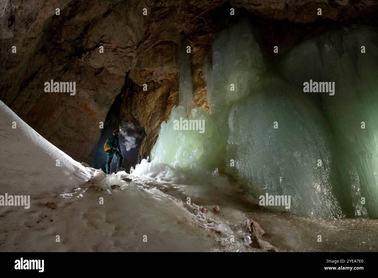 Caver exploring the beautiful, spectacular and unique ice caves of the ...