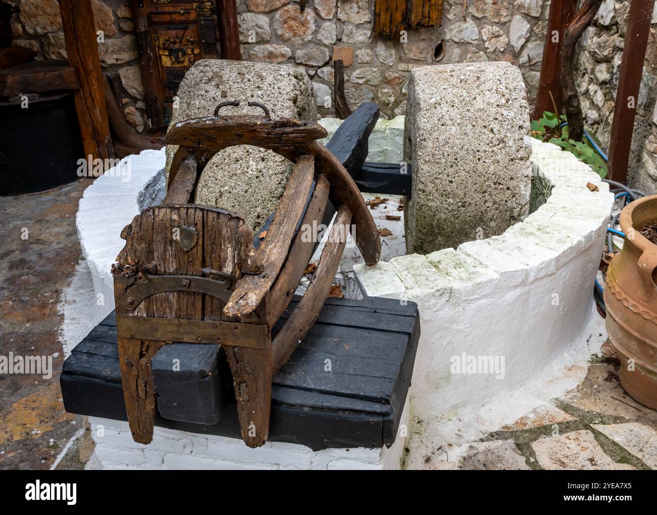 A vintage stone grinder for olive oil making Stock Photo - Alamy