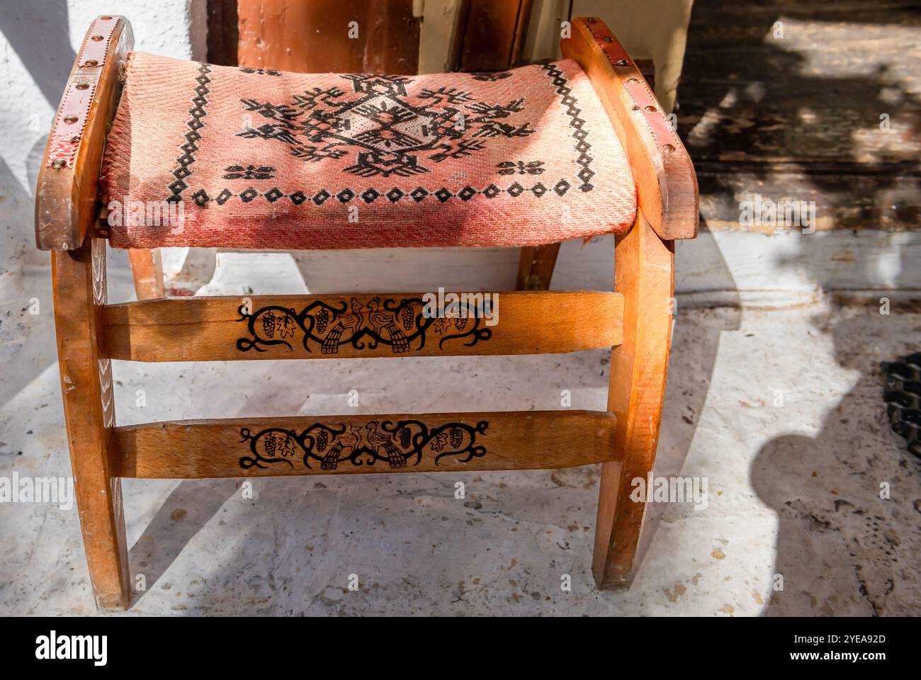 A beautiful vintage wooden stool with carvings, and a embroidered seat ...