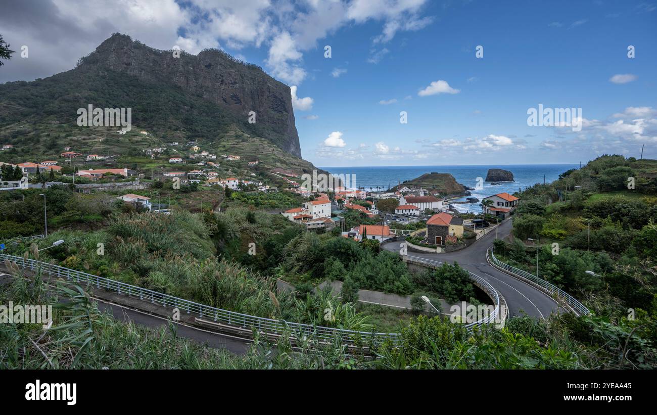 Road winding down the hillside town of Porto Da Cruz on the island of ...