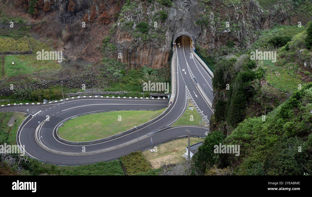 Road infrastructure with mountainside tunnel in the village of Ribeira ...