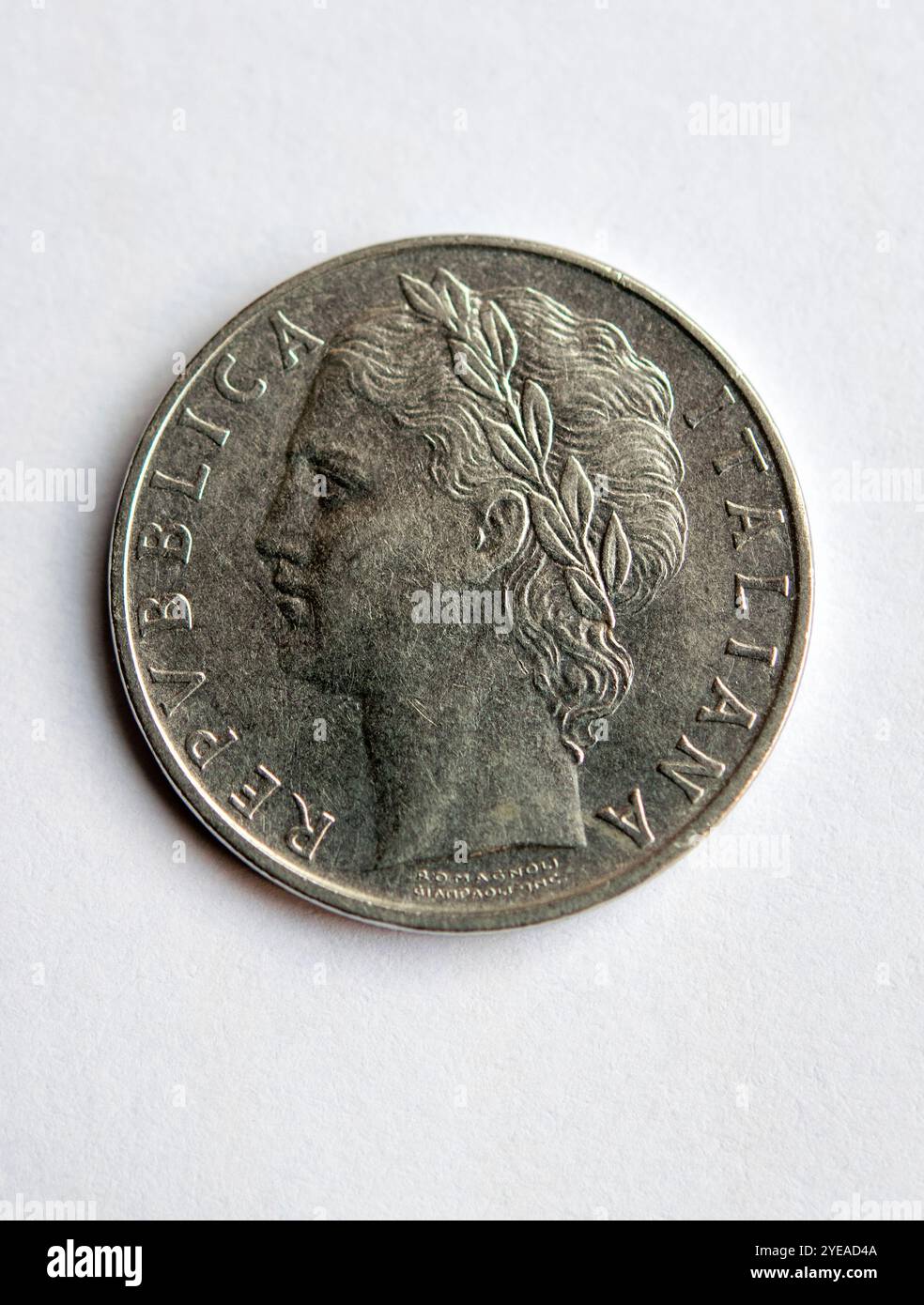 Still life of an Italian 100 lire coin dated 1962. The lira was the ...