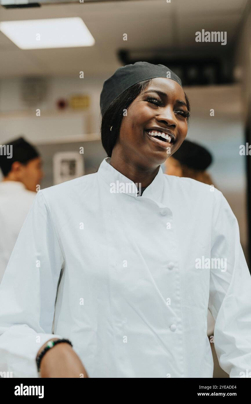Cheerful female teenage trainee working at restaurant high school Stock ...